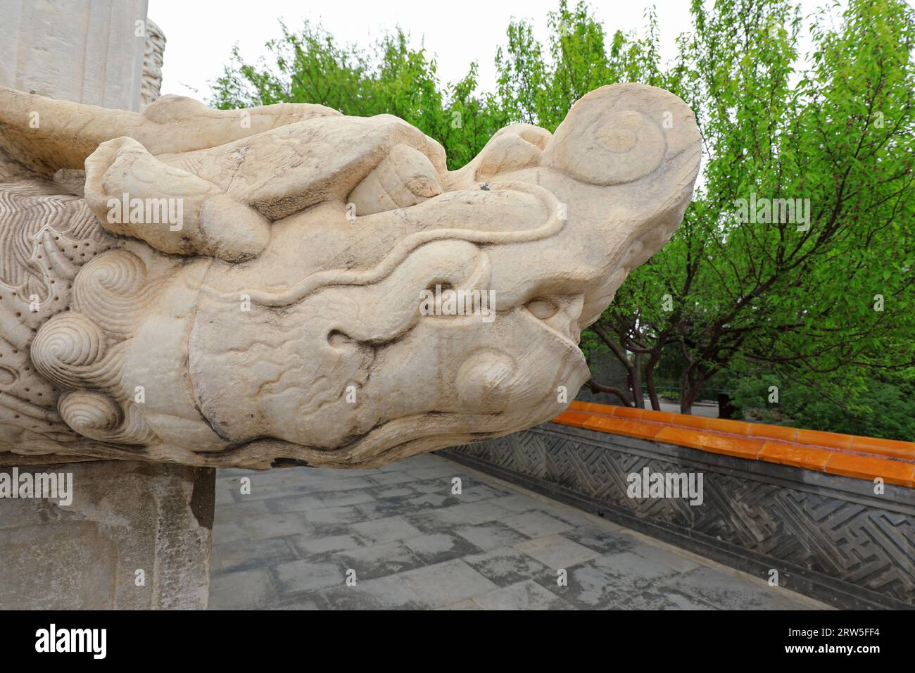 The dragon head sculpture is in a temple, Beijing Stock Photo - Alamy