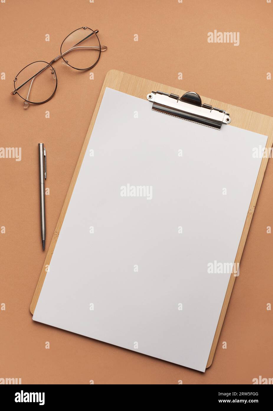 Clipboard with blank sheet and glasses, workplace Stock Photo - Alamy