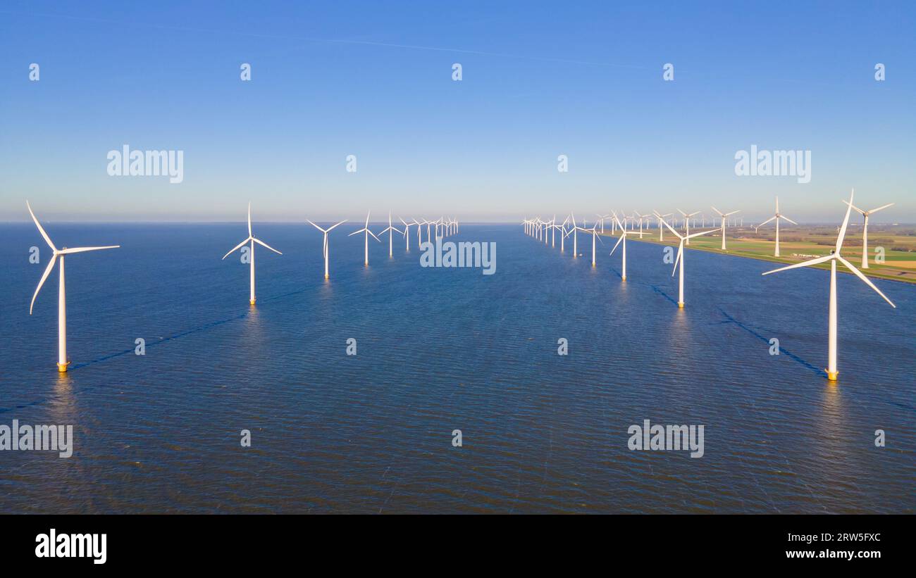 Ocean Wind Farm. Windmill farm in the ocean. Offshore wind turbines in ...