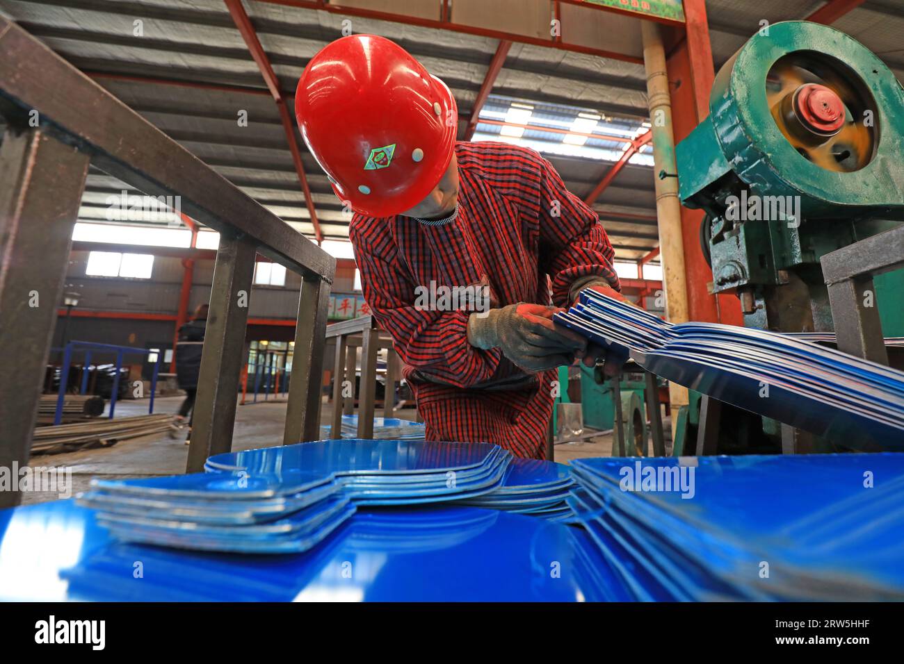 LUANNAN COUNTY, China - April 22, 2021: workers work hard on the steel ...