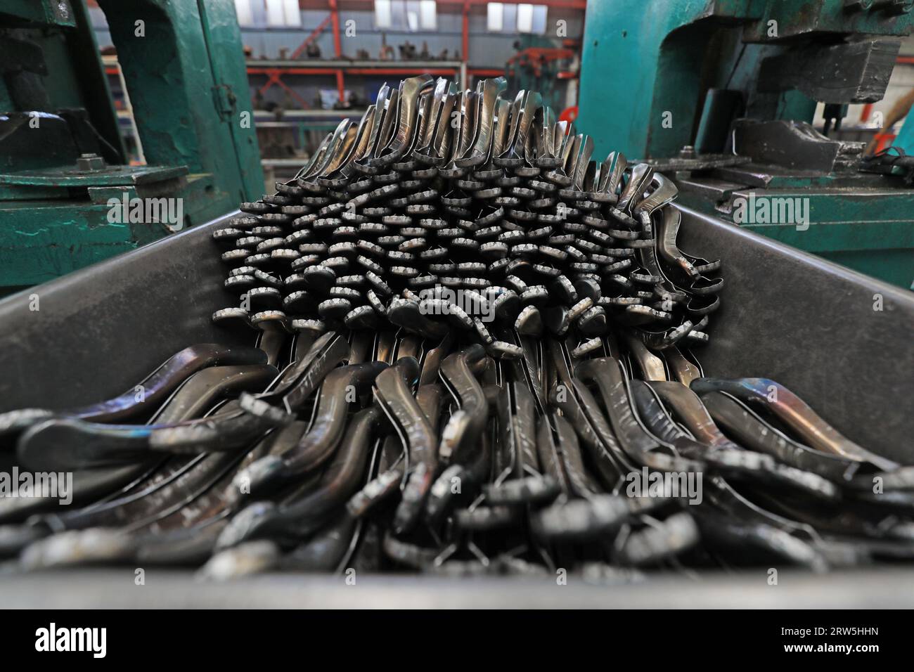 Metal parts pile up in the factory Stock Photo - Alamy