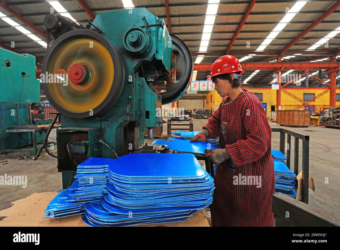 LUANNAN COUNTY, China - April 22, 2021: workers work hard on the steel ...