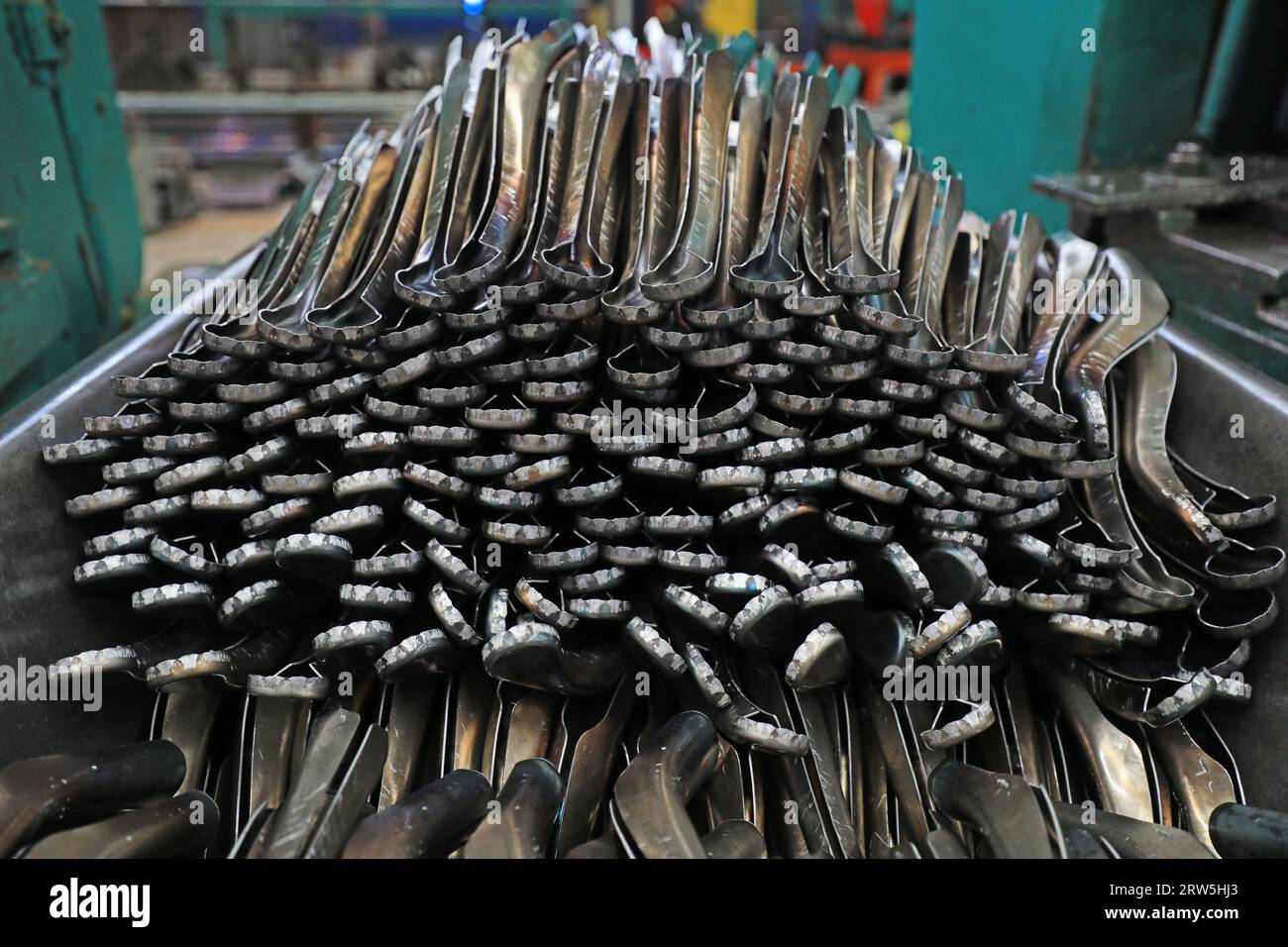 Metal parts pile up in the factory Stock Photo - Alamy