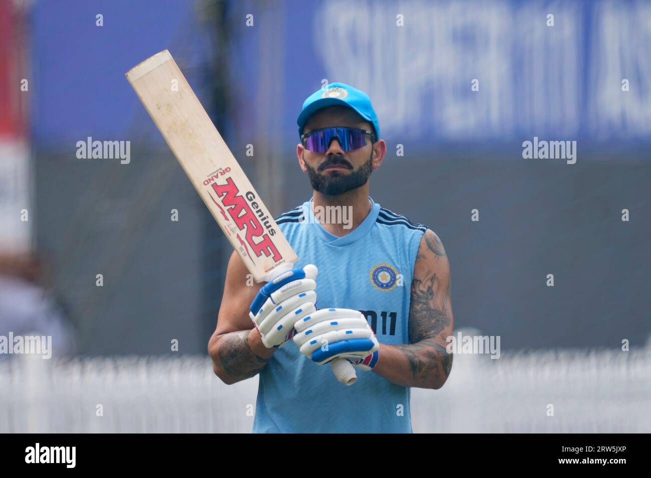 India's captain batsman Virat Kohli hold his bat before Asia Cup final ...