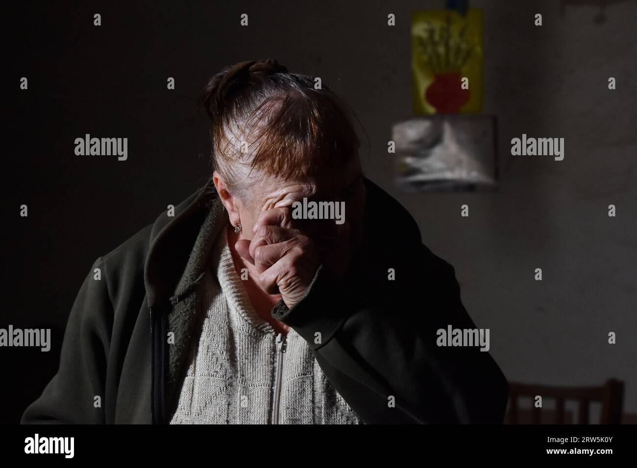 Huliaipole, Ukraine. 14th Sep, 2023. Olga, 71-years old, is crying and ...