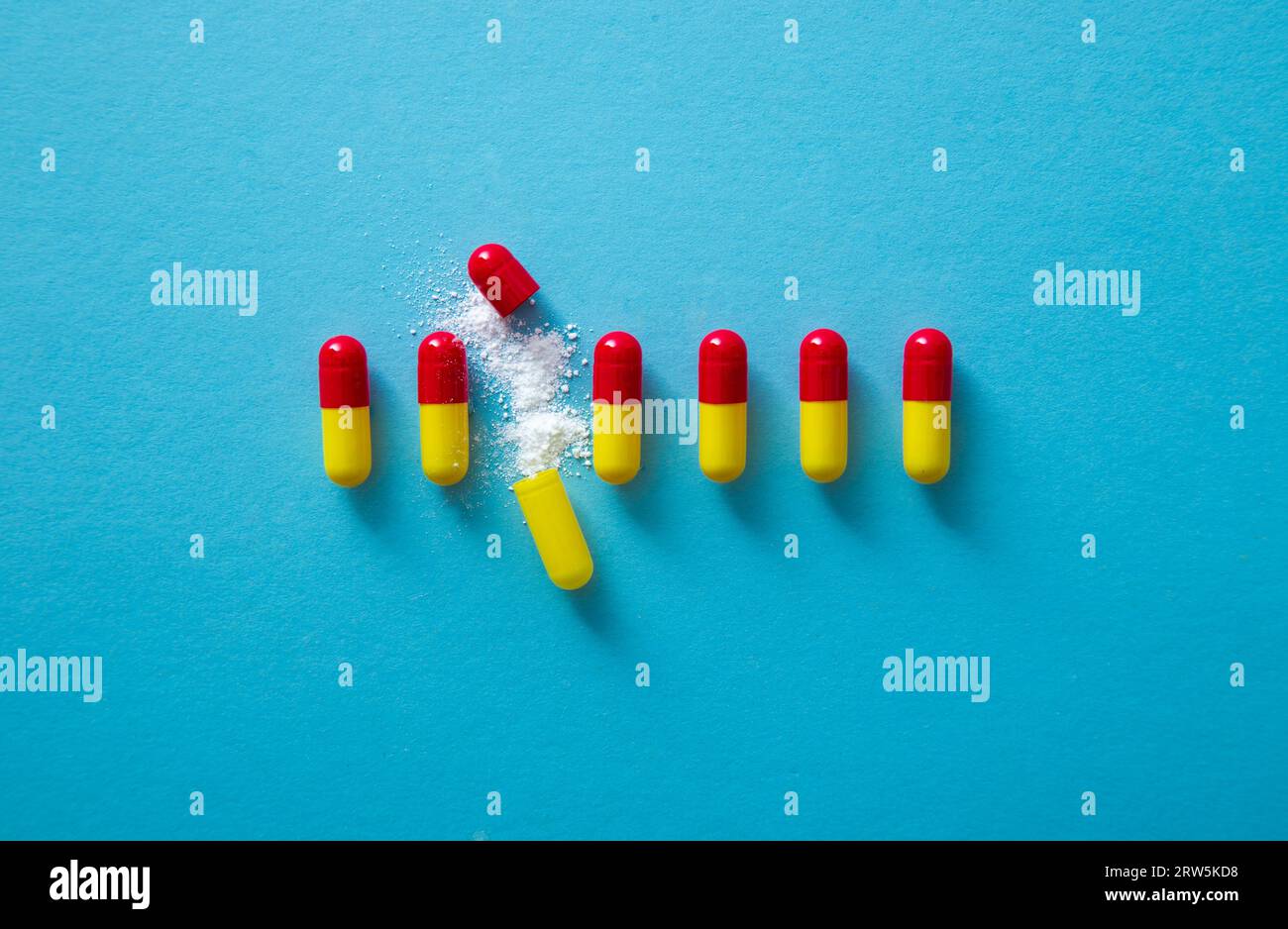 Pharmaceutical capsules with medication powder Stock Photo - Alamy