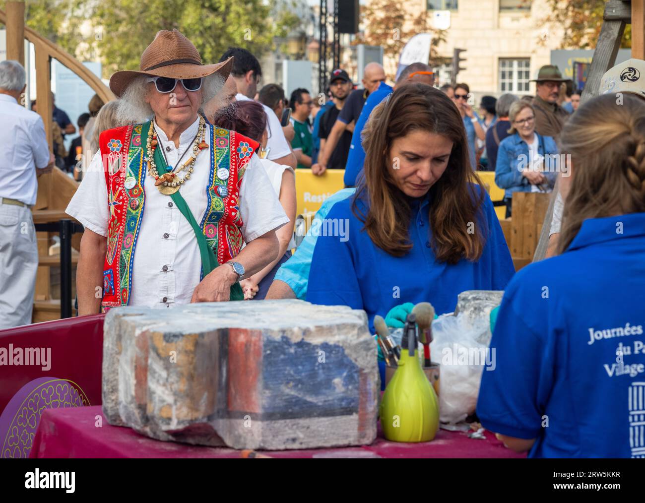 A colourfully dressed French man at the European Heritage Day watches ...