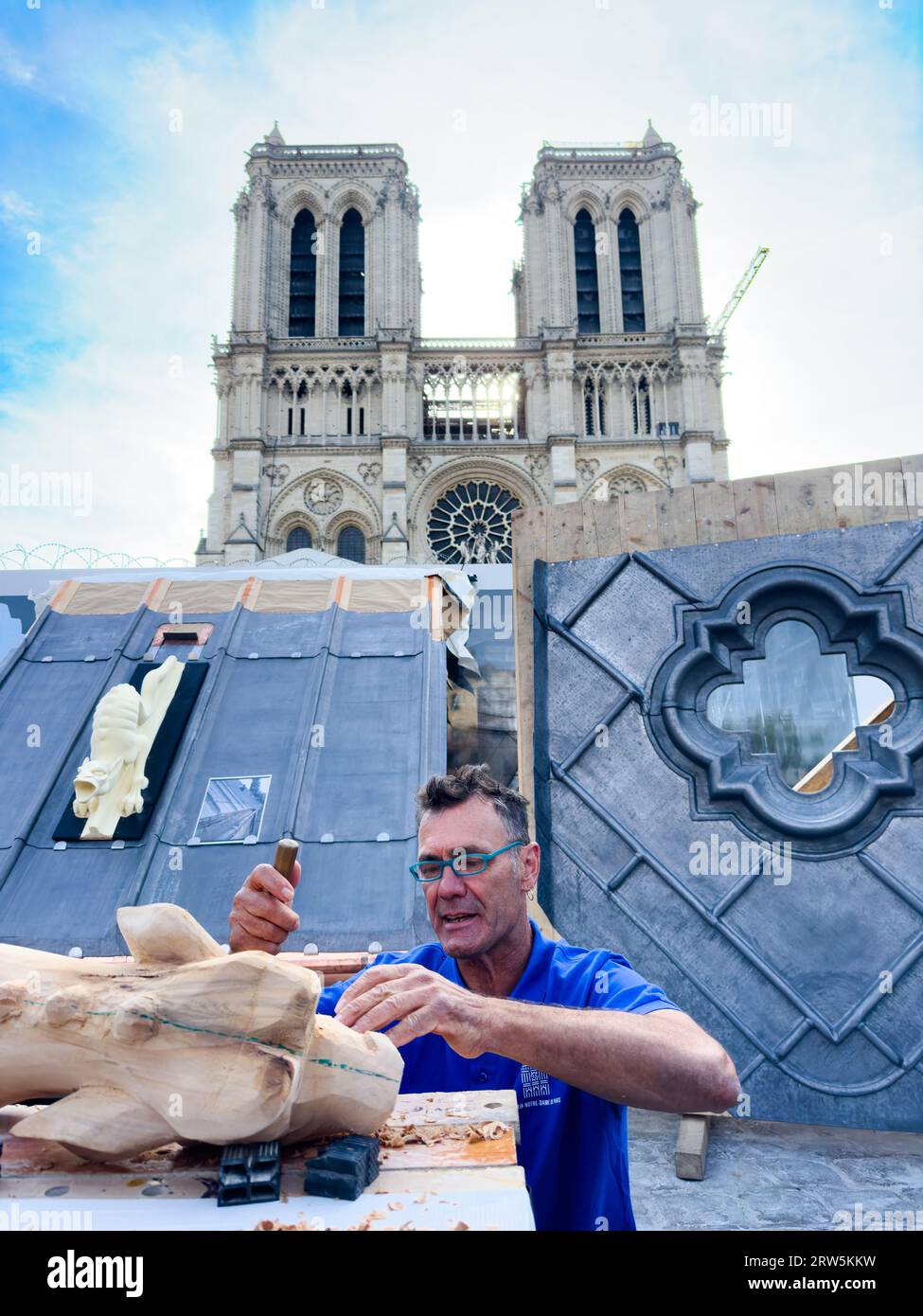 A French artisan woodworker carves a gargoyle using traditional methods ...