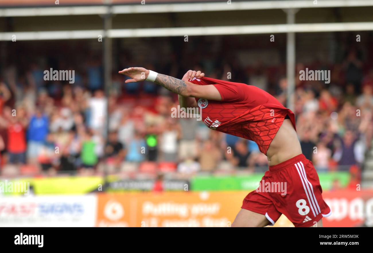 Klaidi Lolos of Crawley takes off his shirt to celebrate scoring the ...