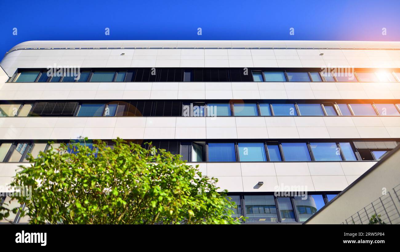 The exterior wall of a contemporary commercial-style building with ...