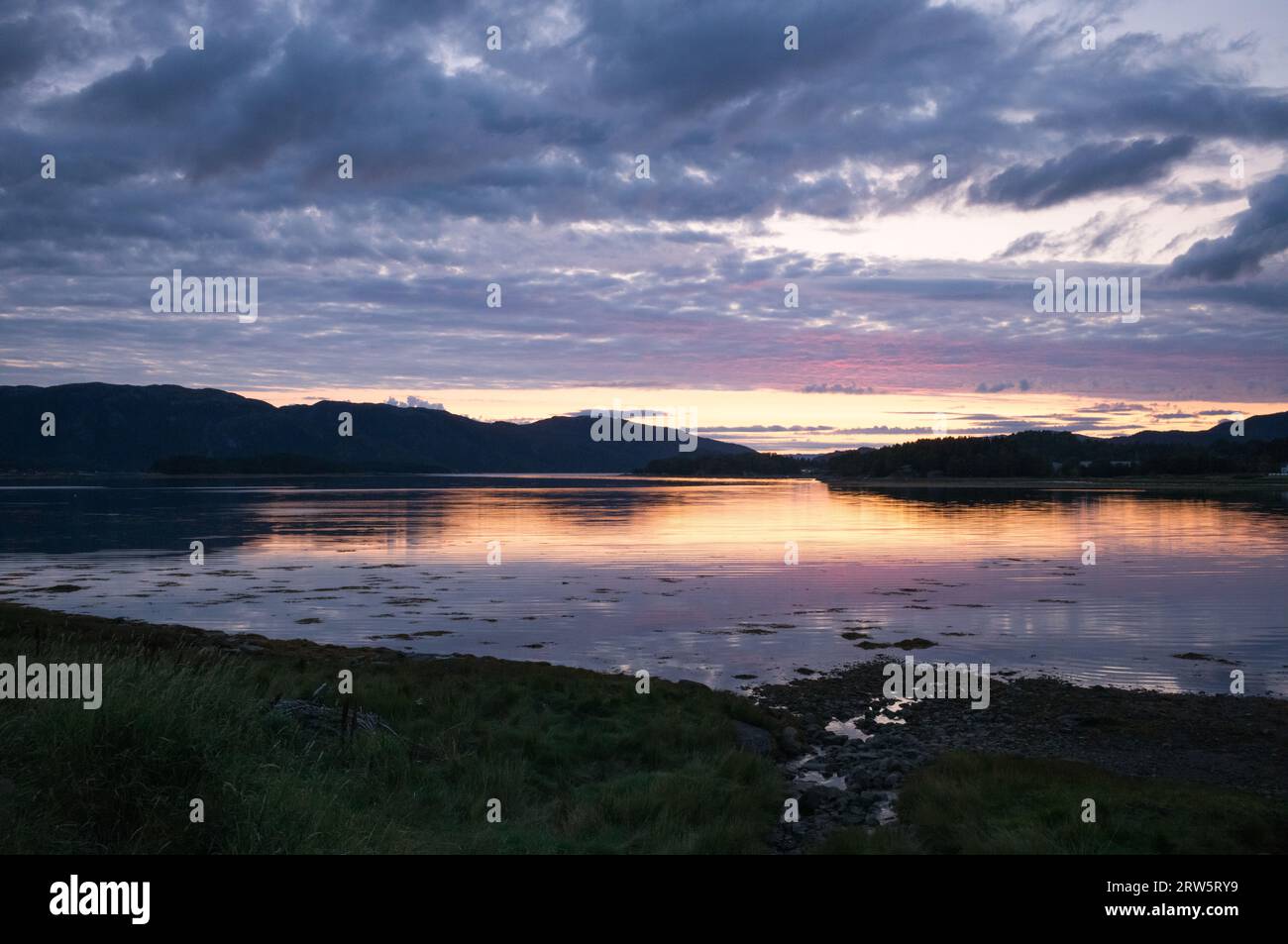 Sunset over a Norwegian fjord Stock Photo - Alamy