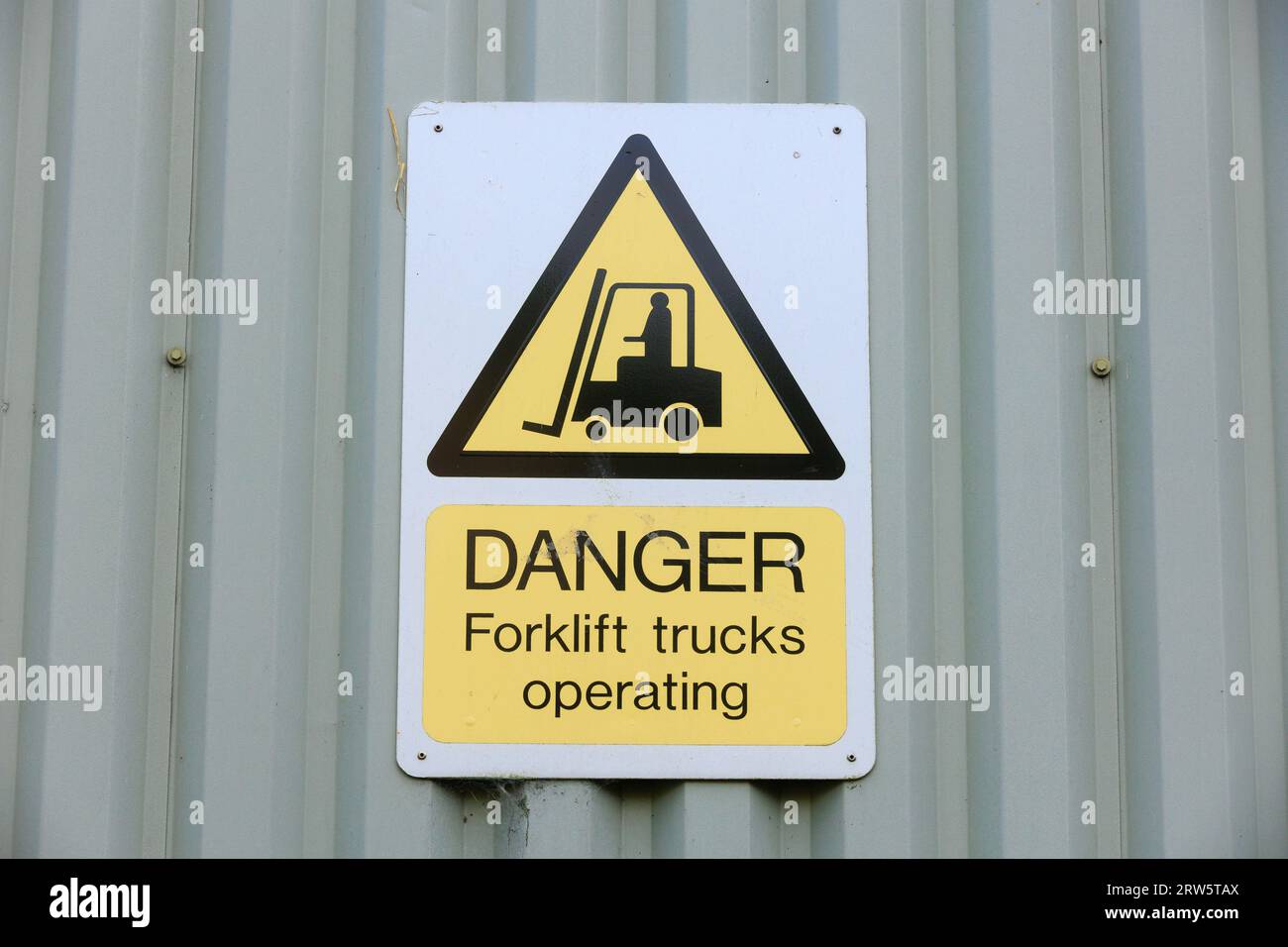 Danger Forklift trucks operating warning sign Stock Photo - Alamy