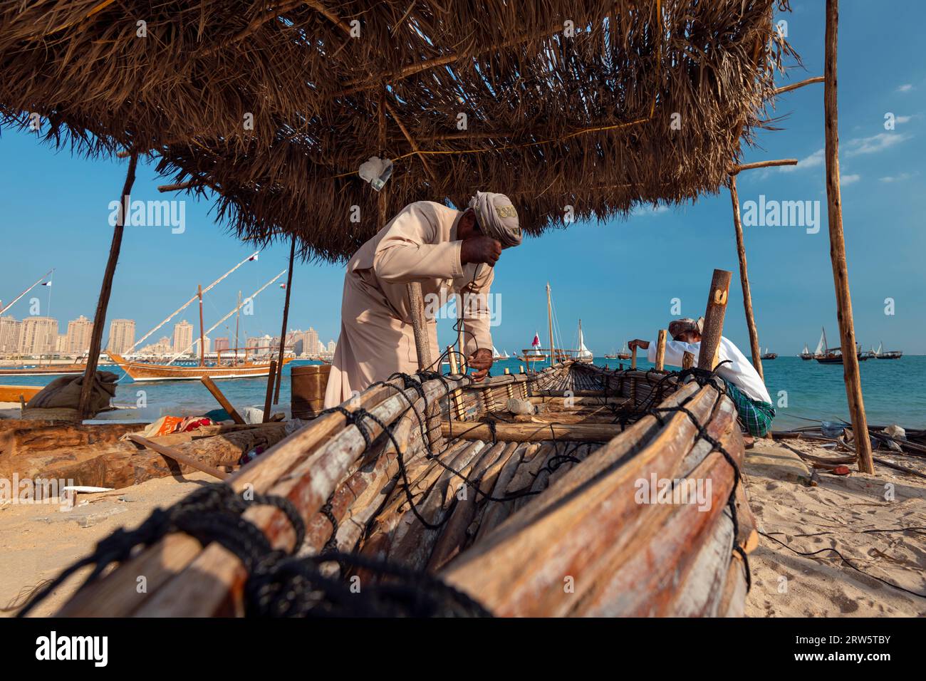 Dhow wooden boat maker. constructing dhow boat. Dhow Festival Doha ...