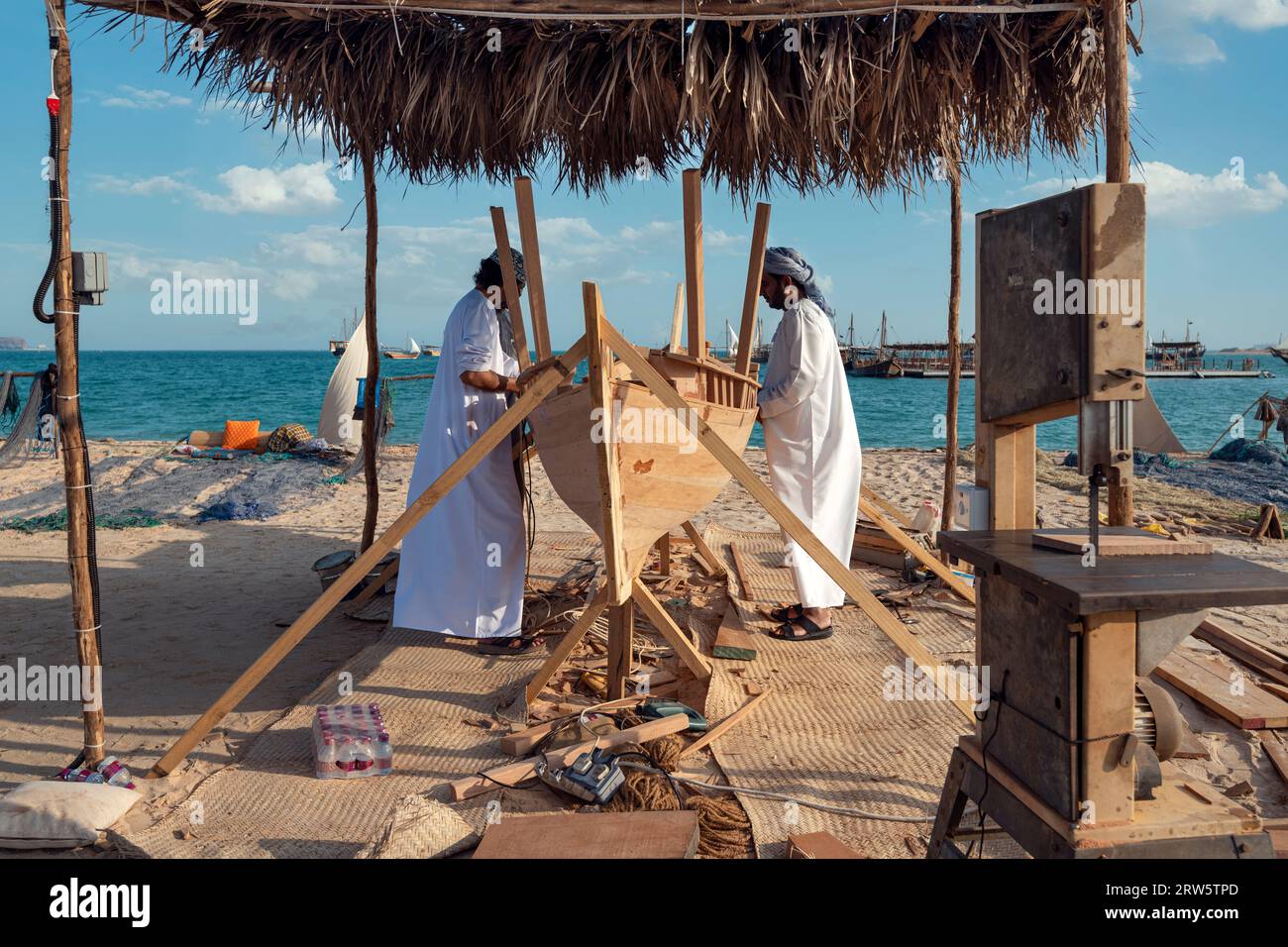 Dhow wooden boat maker. constructing dhow boat. Dhow Festival Doha ...
