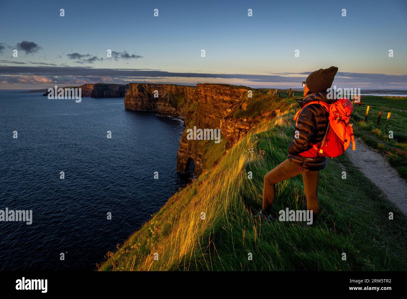 Cliffs of Moher, cliffside hiker, The Burren, County Clare, Ireland ...