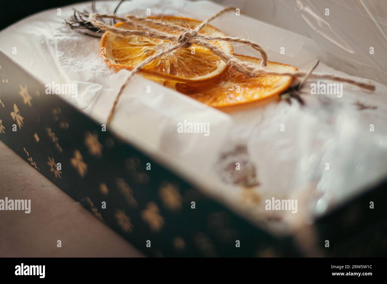 Christmas stollen decorated with dried orange fruits and spruce branch ...