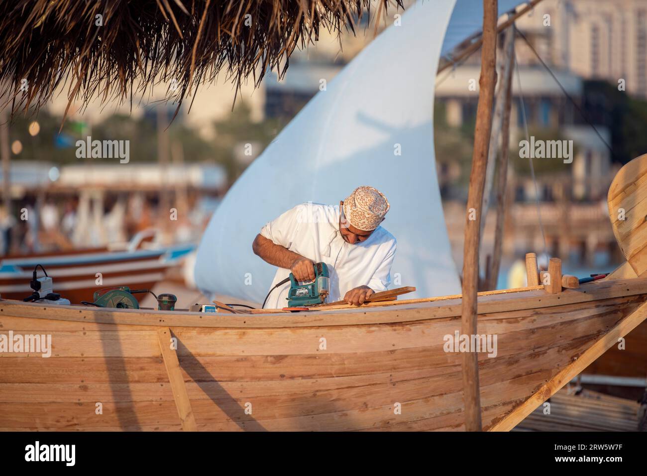 Dhow wooden boat maker. constructing dhow boat. Dhow Festival Doha ...