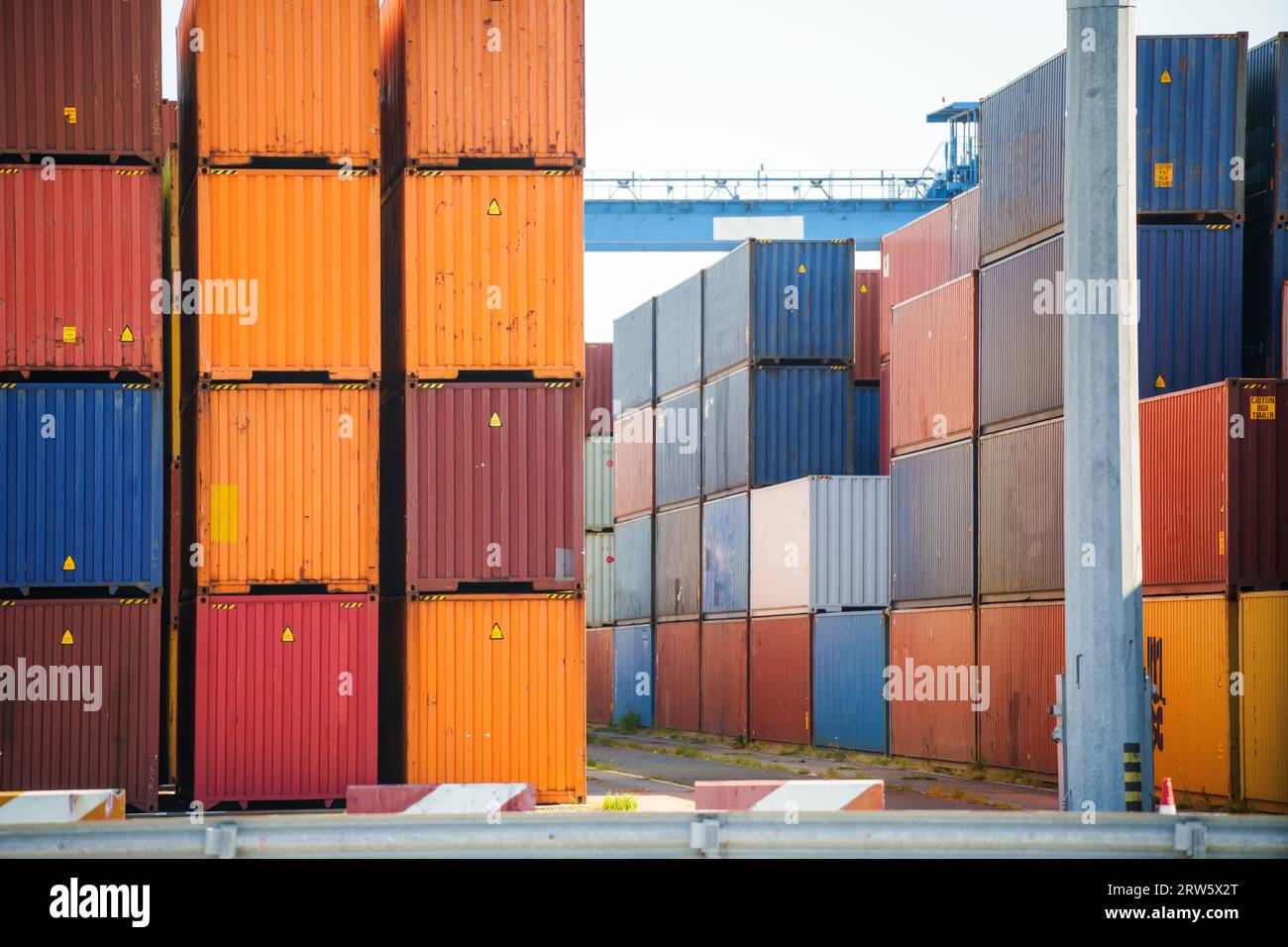 Shipping containers stacked at a commercial port Stock Photo - Alamy