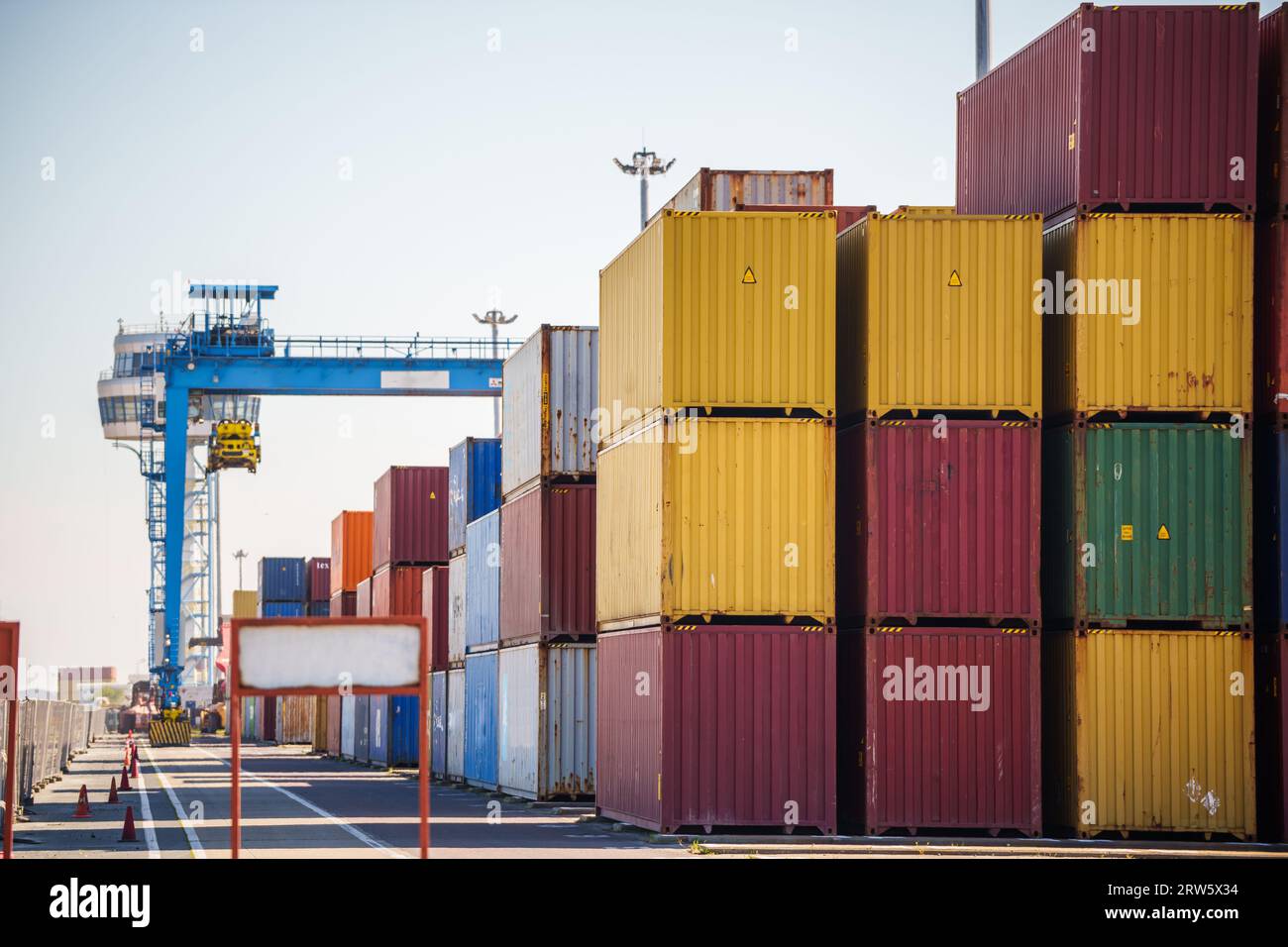 Shipping containers stacked at a commercial port Stock Photo - Alamy