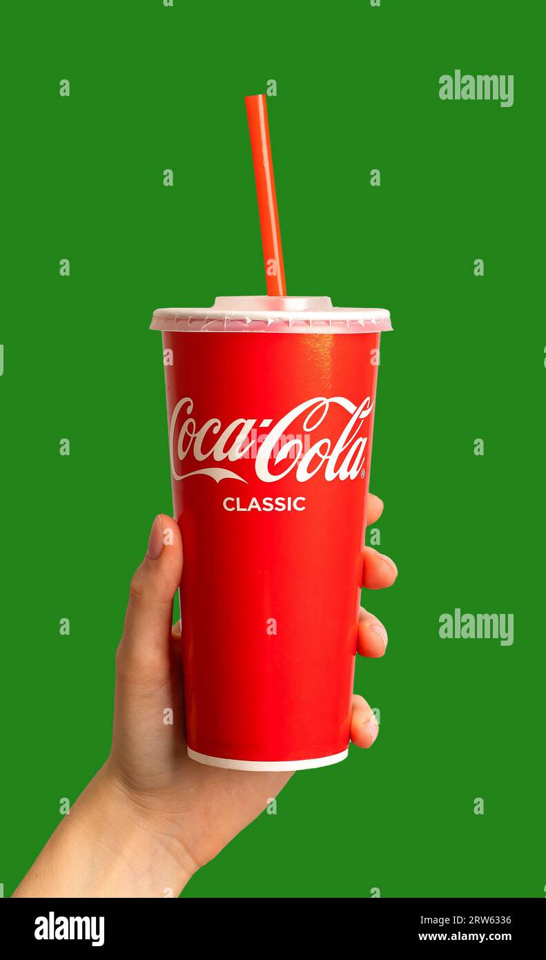 Berlin, Germany September 16 2023 Hand holding Coca Cola, paper cup ...