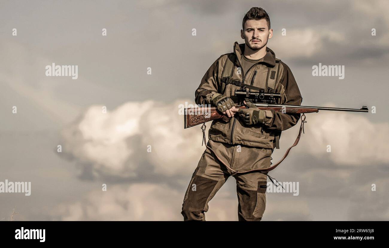 Hunter with hunting gun and hunting form to hunt sky background. Hunter ...