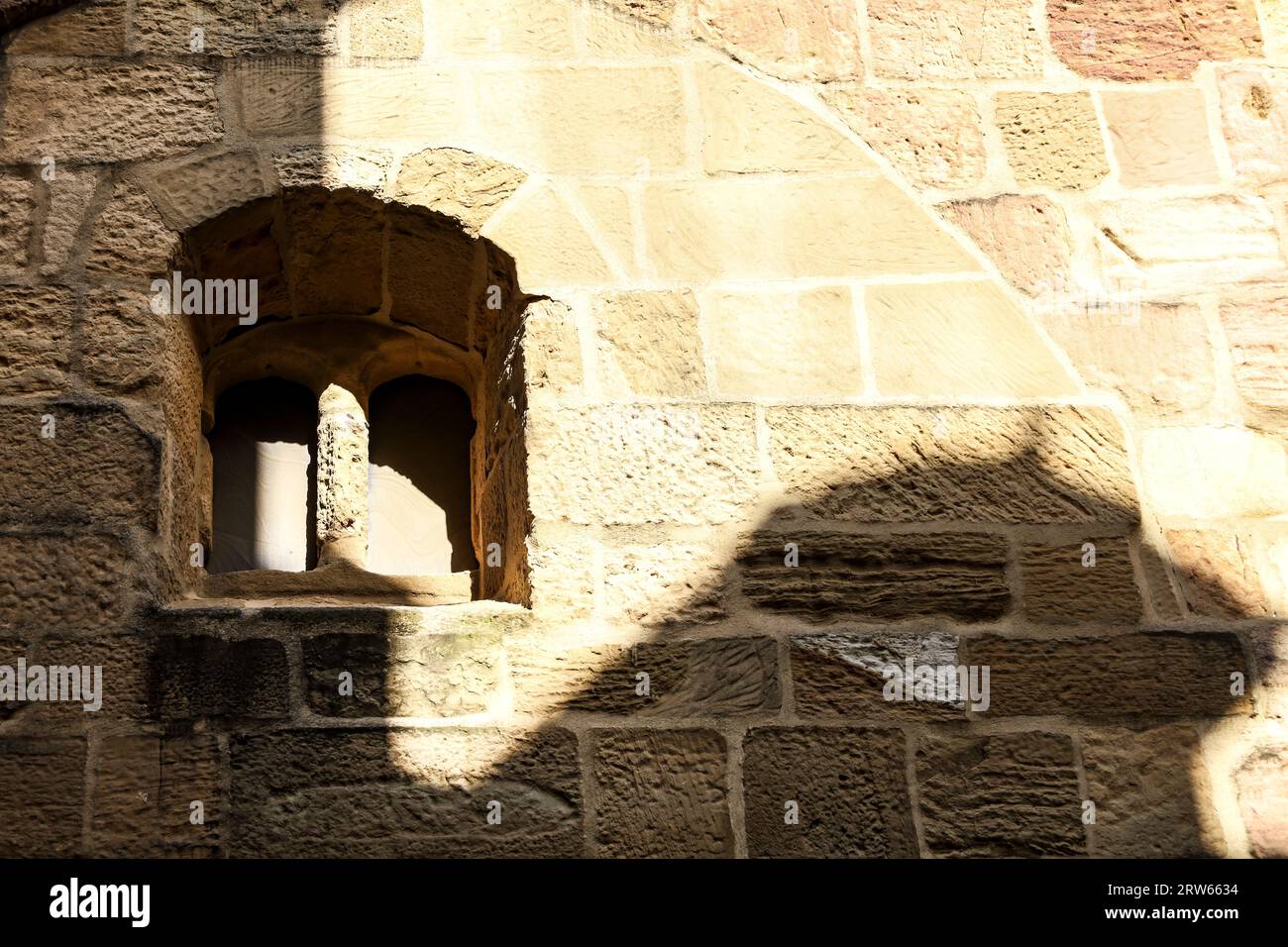 Eroded sandstone window with pillar of San Salvador church in Getaria ...
