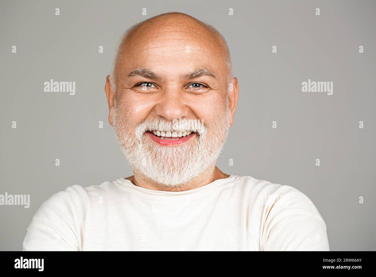 Portrait happy smile senior elderly old beard man face isolated on gray ...