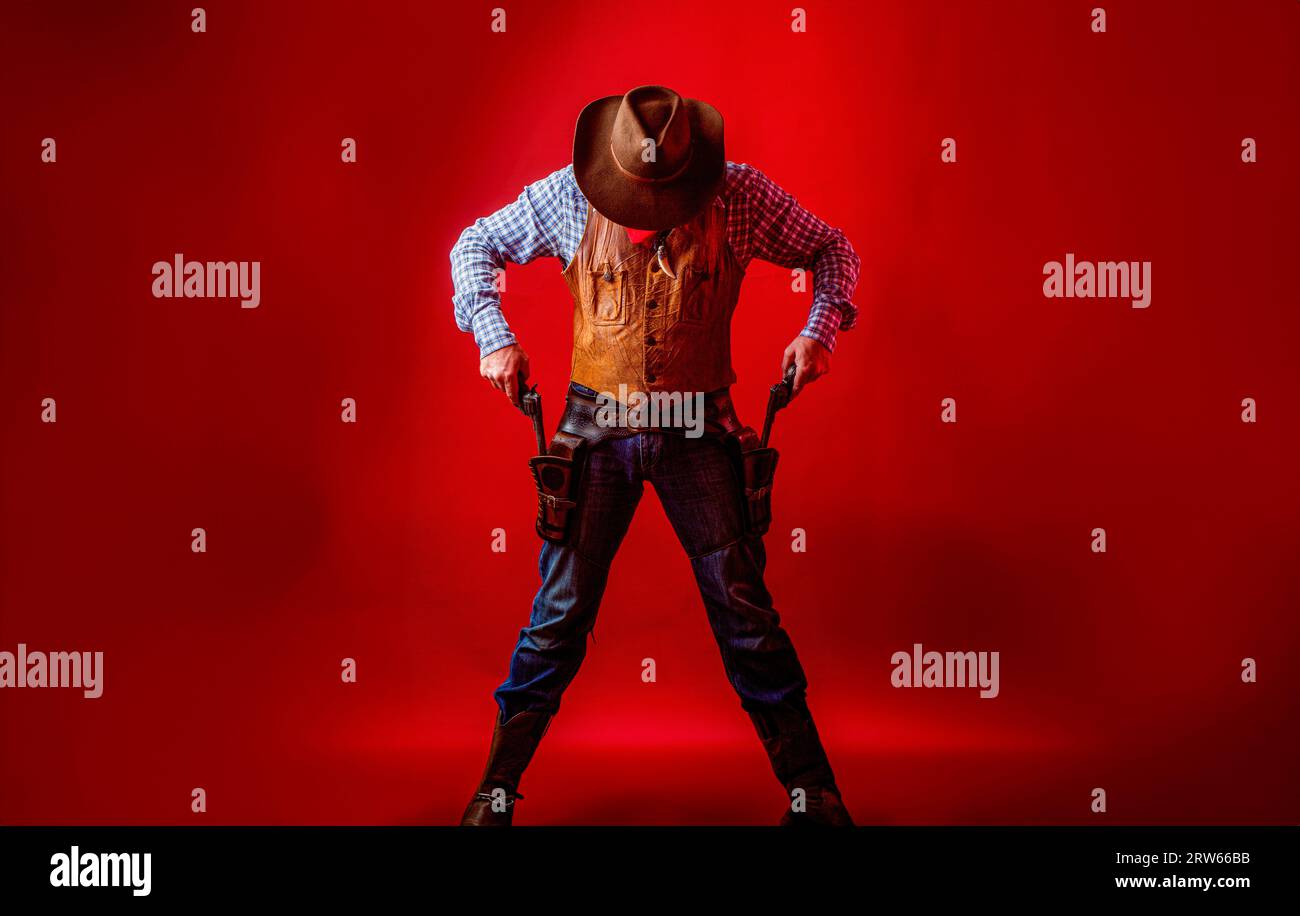 Portrait of man wearing cowboy hat, gun. Portrait of a cowboy. West ...