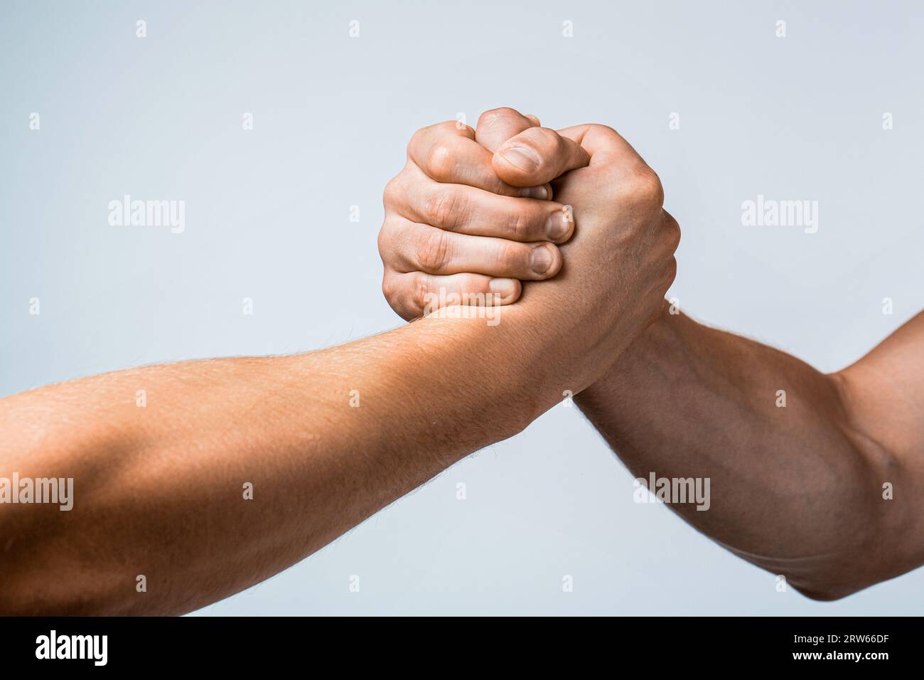 Friendly handshake, friends greeting, teamwork, friendship. Rescue, helping gesture or hands ...