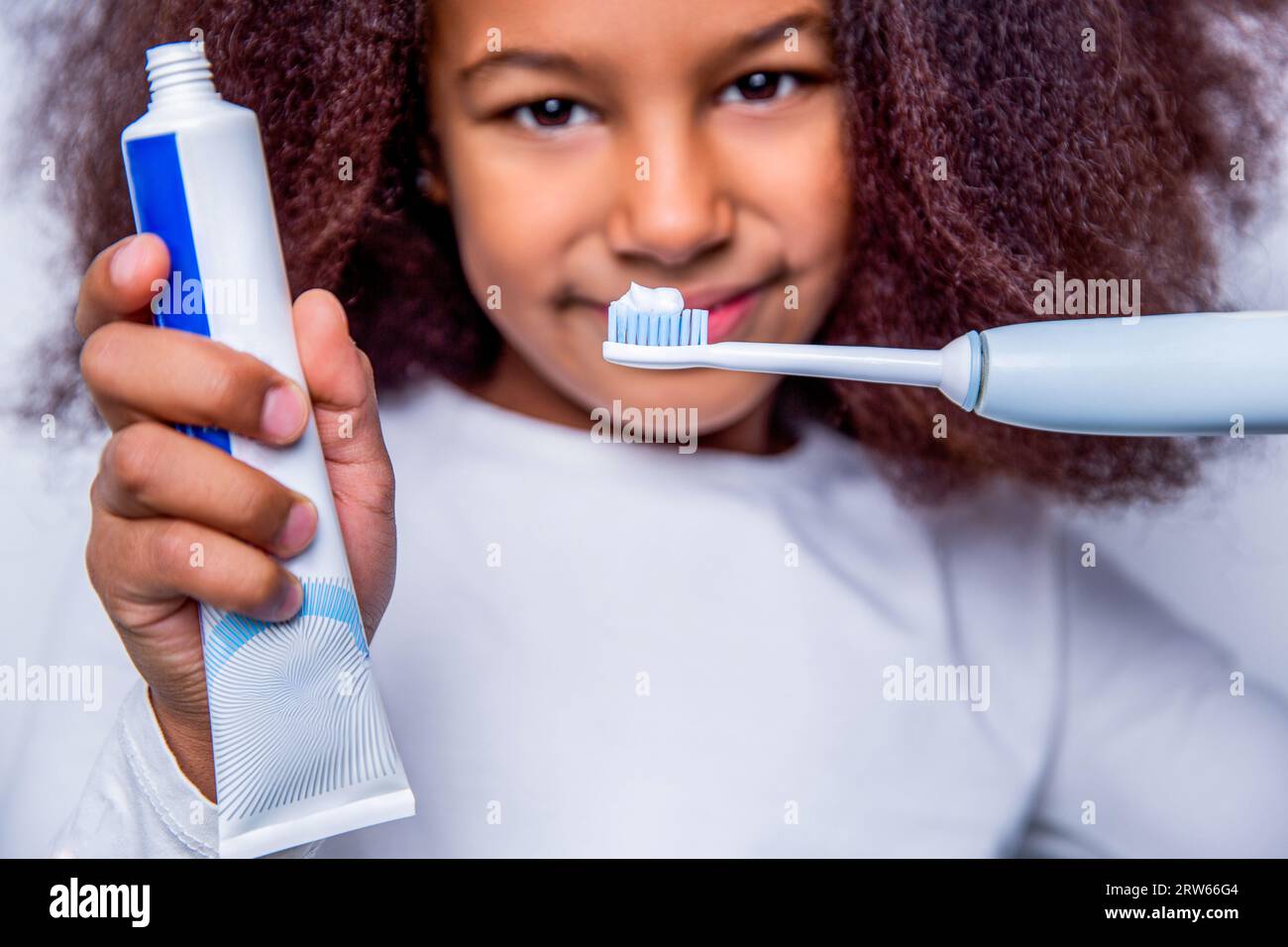 Little girl toothbrush closeup. Little cute african american girl ...