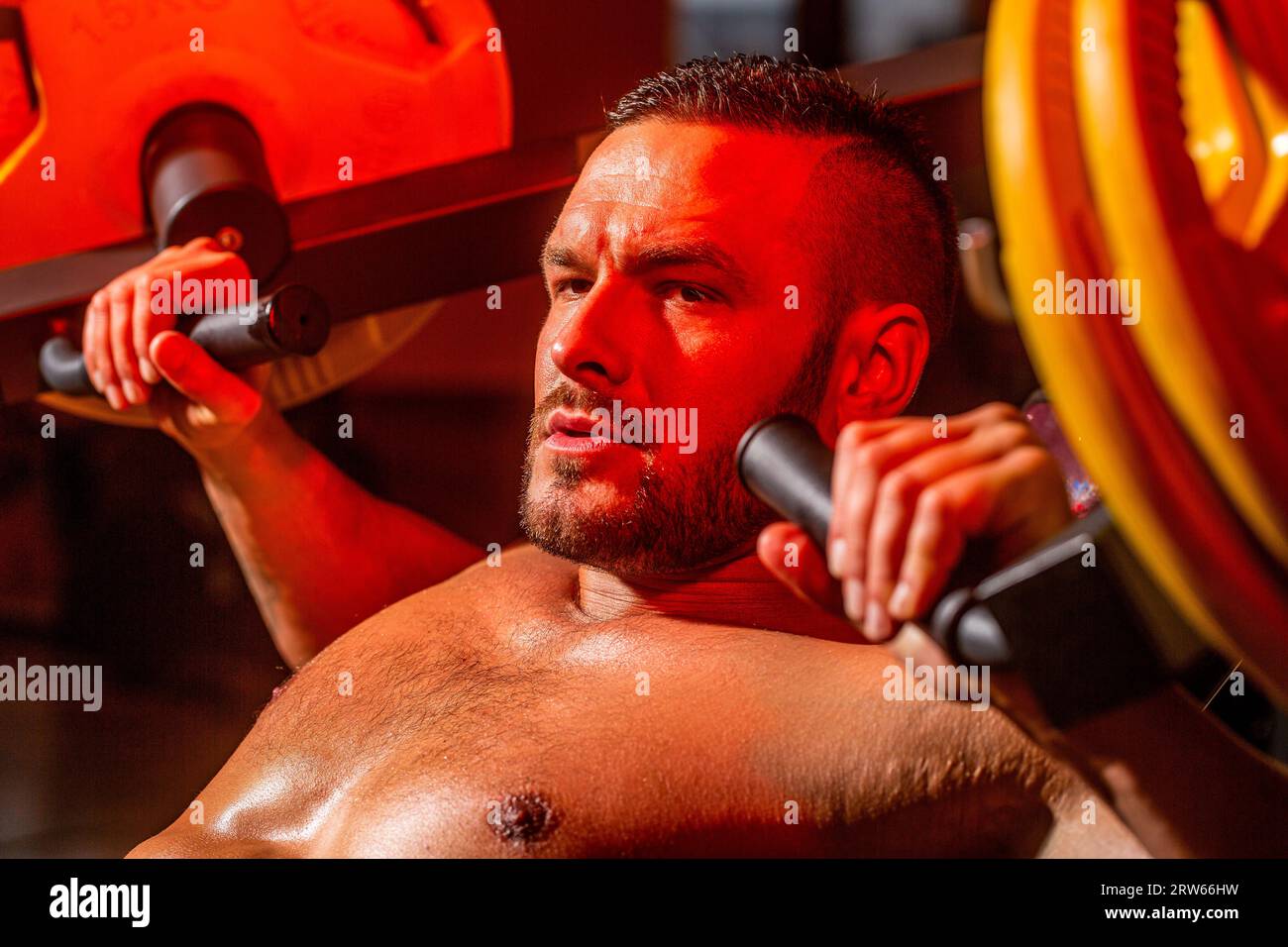Young man strongman exercise hi-res stock photography and images - Alamy