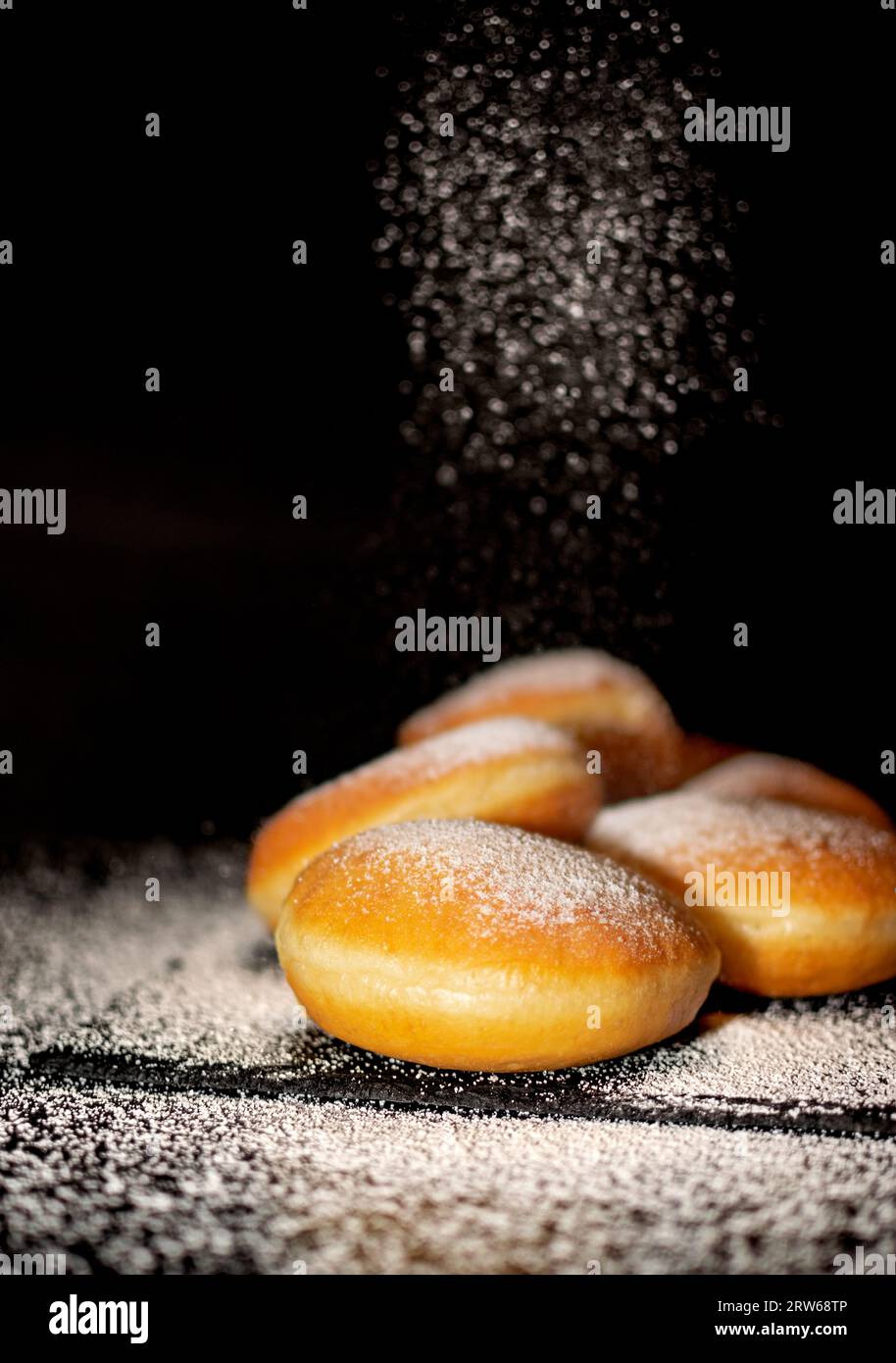 German Krapfen with drizzling glazed sprinkles in black elegant ...