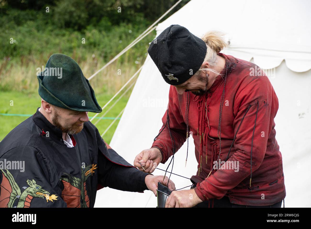 Kenilworth England July 29th 2023 A squire is arming his knight the ...