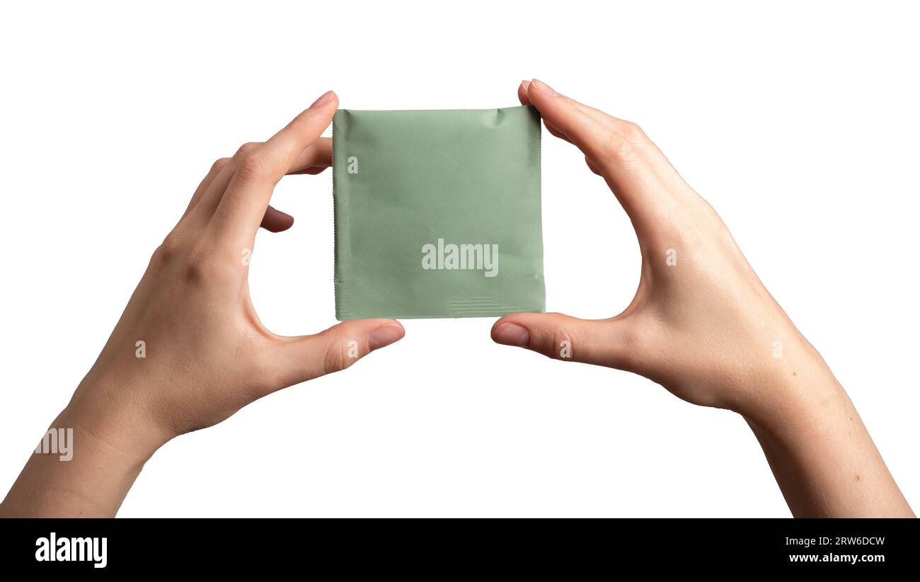Tea bag, sachet, pouch pack mock up. Green teabag mockup in hands ...