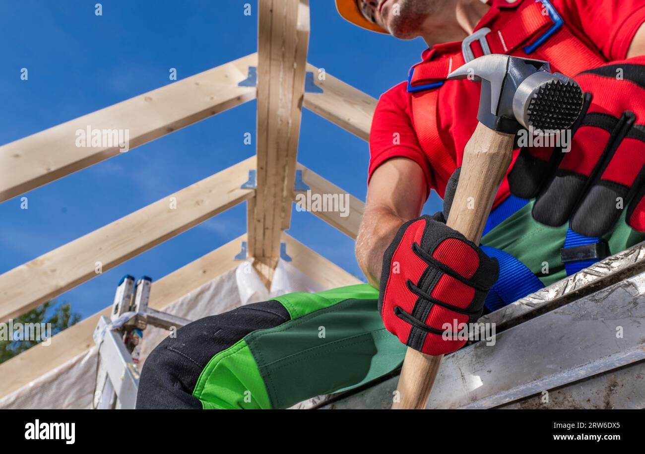 Professional Contractor Worker with Large Hammer Seating Under Wooden ...