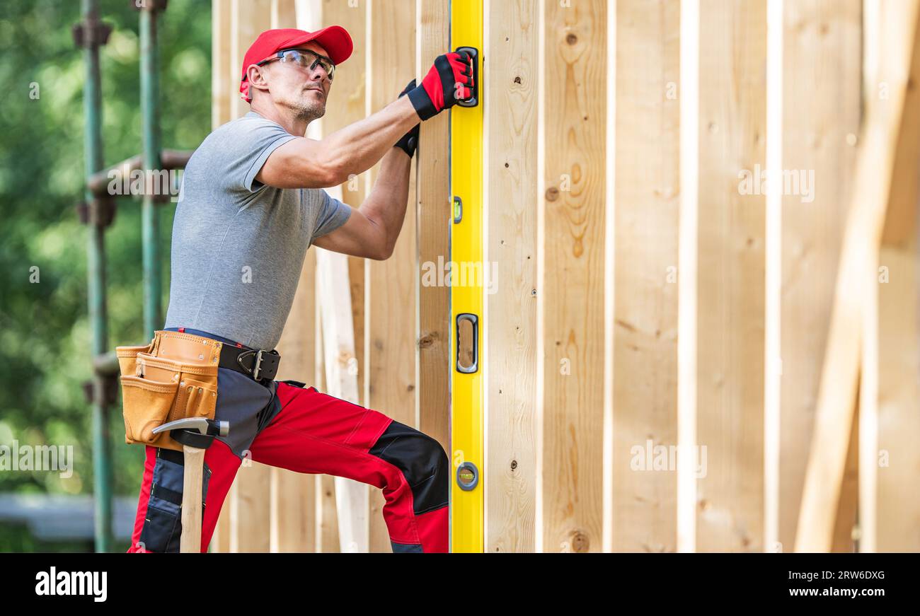 Caucasian Construction Contractor with a Spirit Level Instrument in His ...