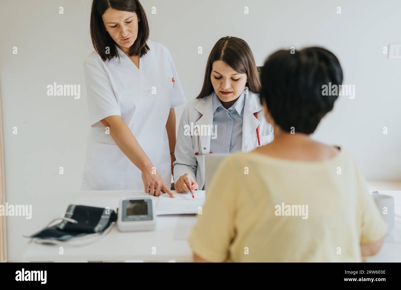 Doctor examining patients condition hi-res stock photography and images ...