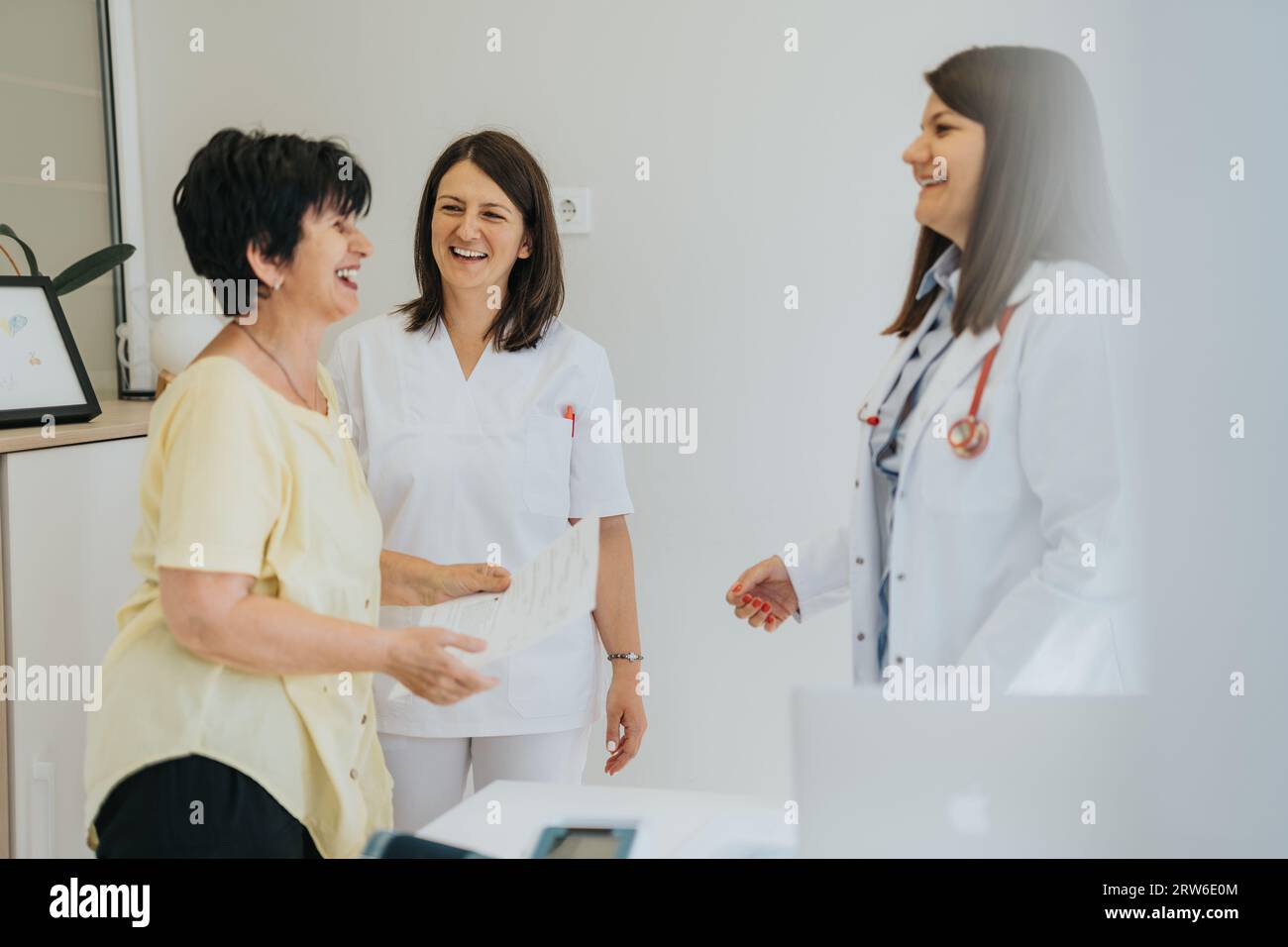 Experienced Doctor Sharing Positive Results with Happy Elderly Patient ...