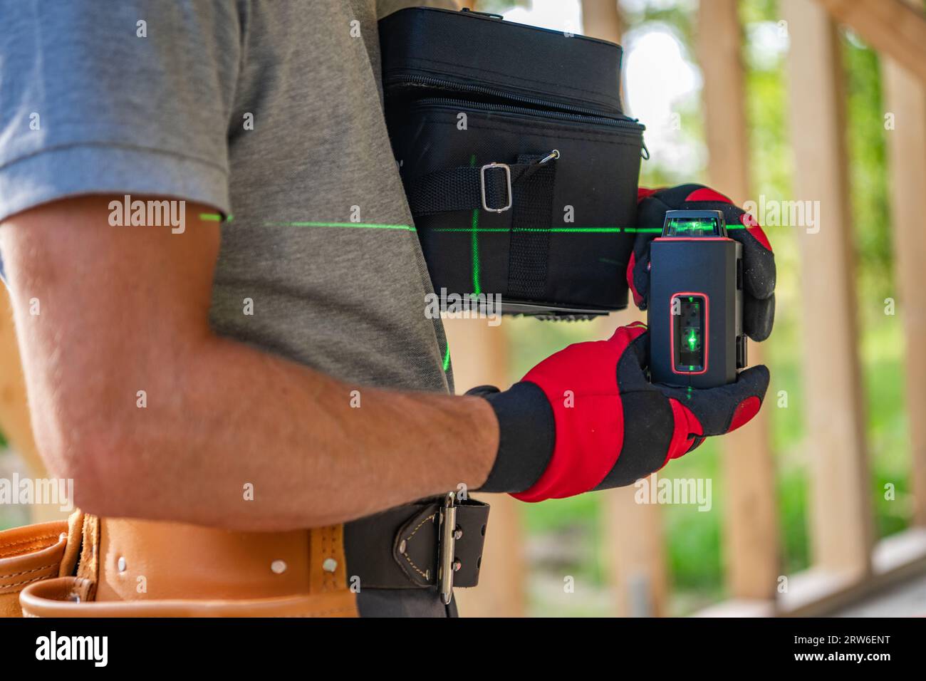 Caucasian Construction Worker with Modern Laser Leveling Tool in His ...