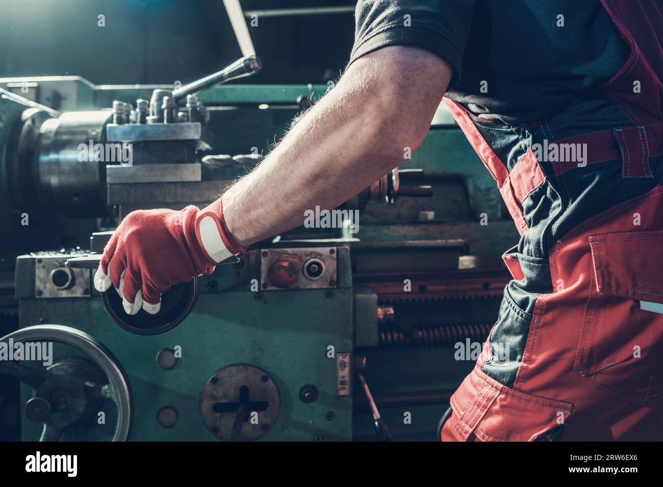 Caucasian Metalworking Worker in His 40s Operating Lathe Machine ...