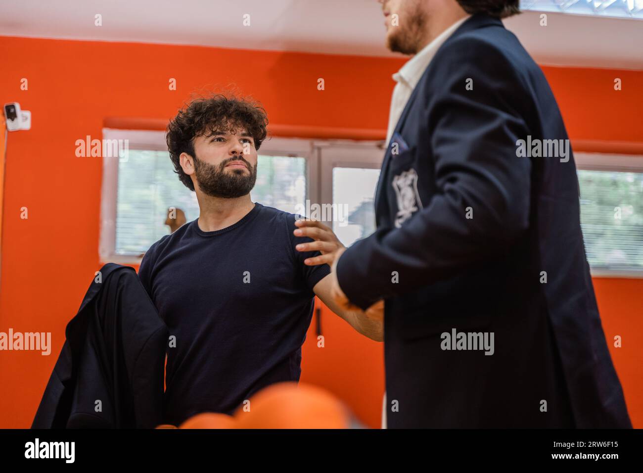 Two male students going on a break after lecture ended Stock Photo - Alamy