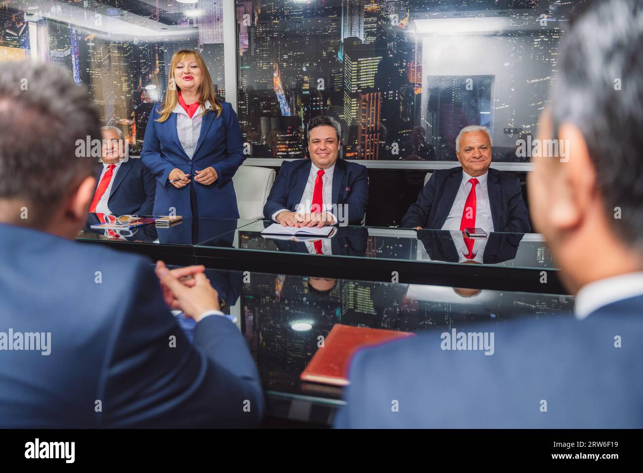 Female college professor delivering speech during meeting with her ...