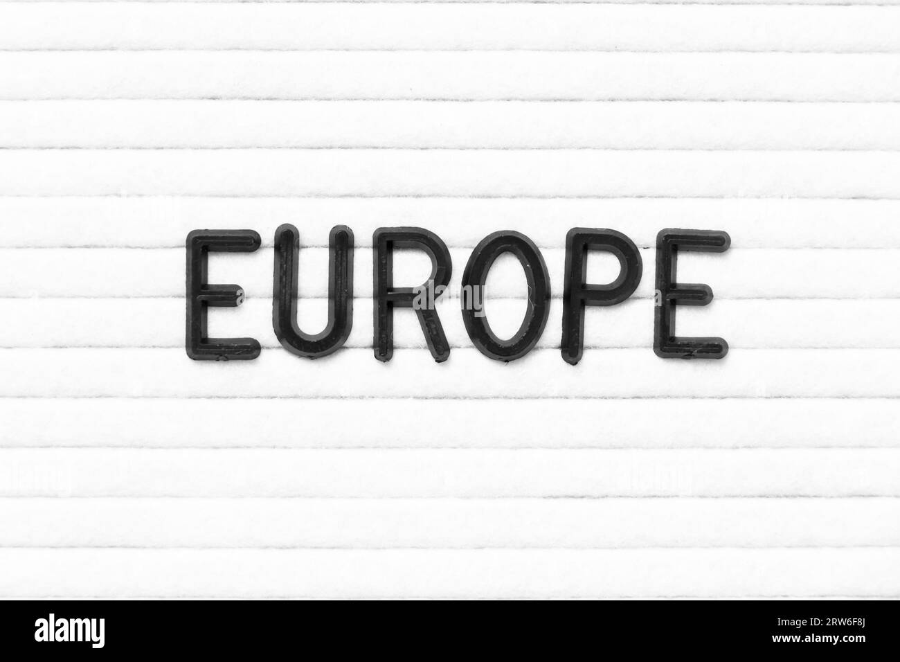 Black color letter in word europe on white felt board background Stock ...