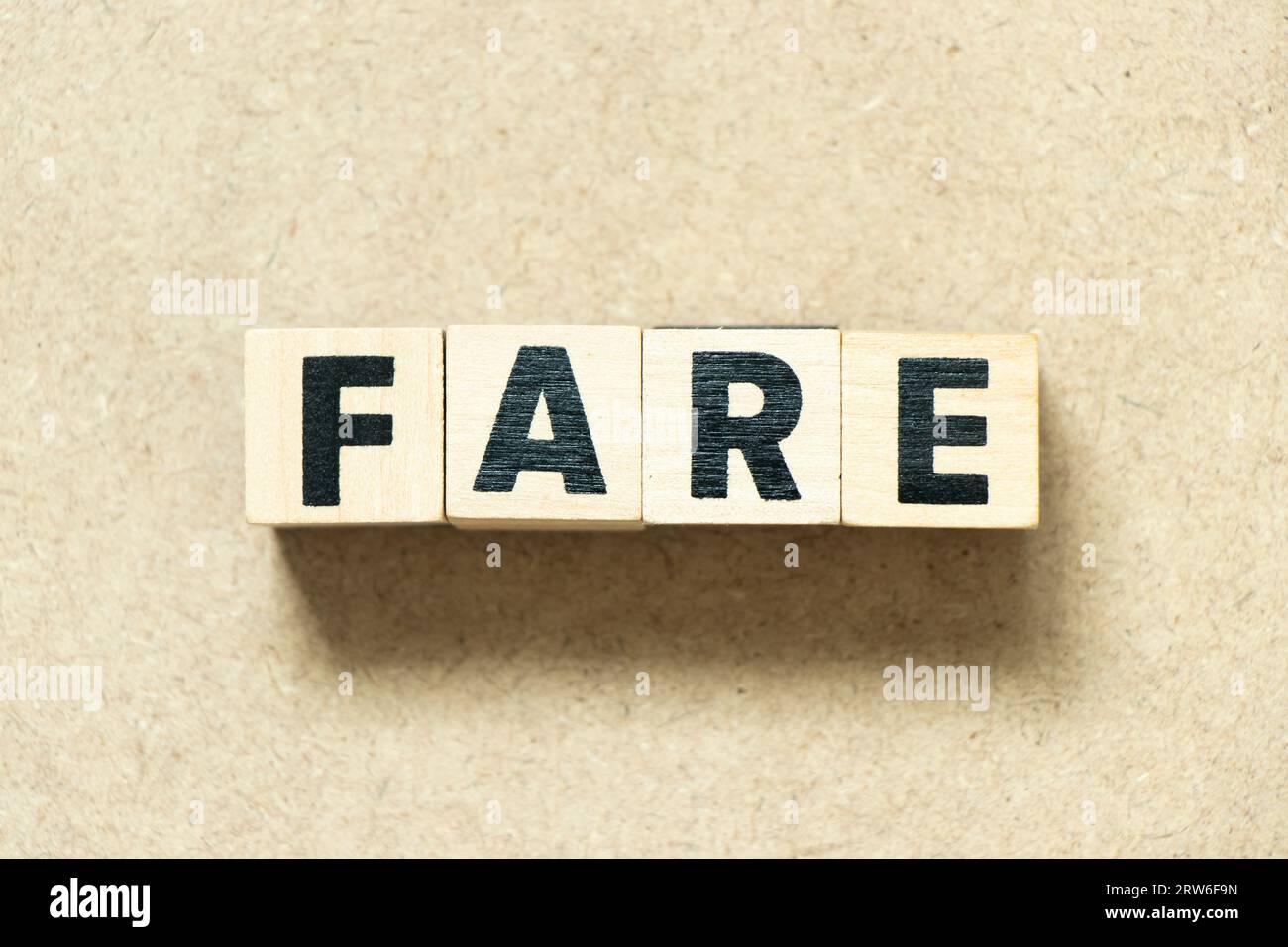Alphabet letter block in word fare on wood background Stock Photo - Alamy