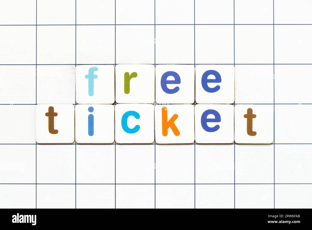 Colorful tile letter in word free ticket on white grid background Stock ...