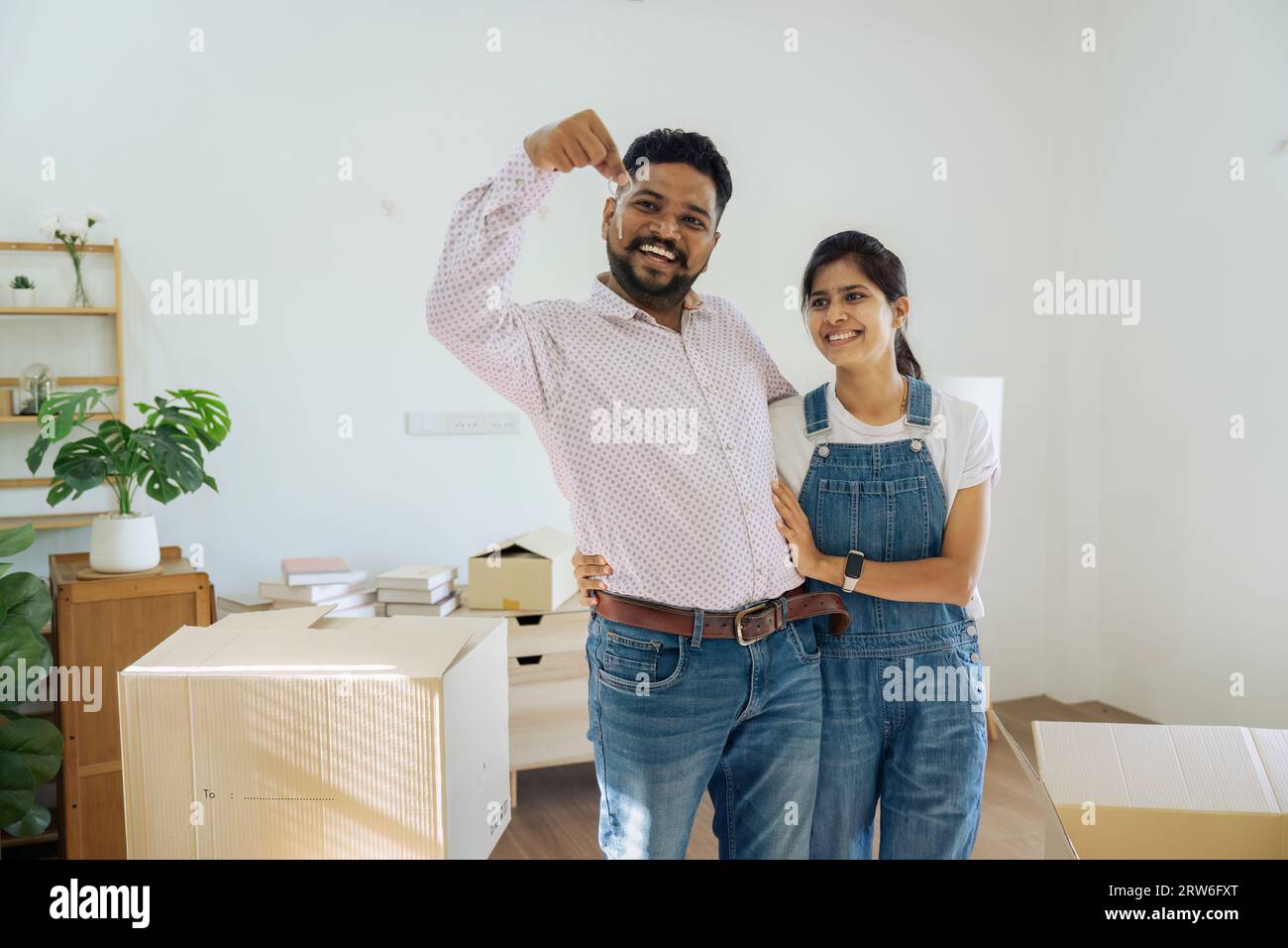 House Ownership. Portrait Of Happy Indian Married Holding Showing Key ...