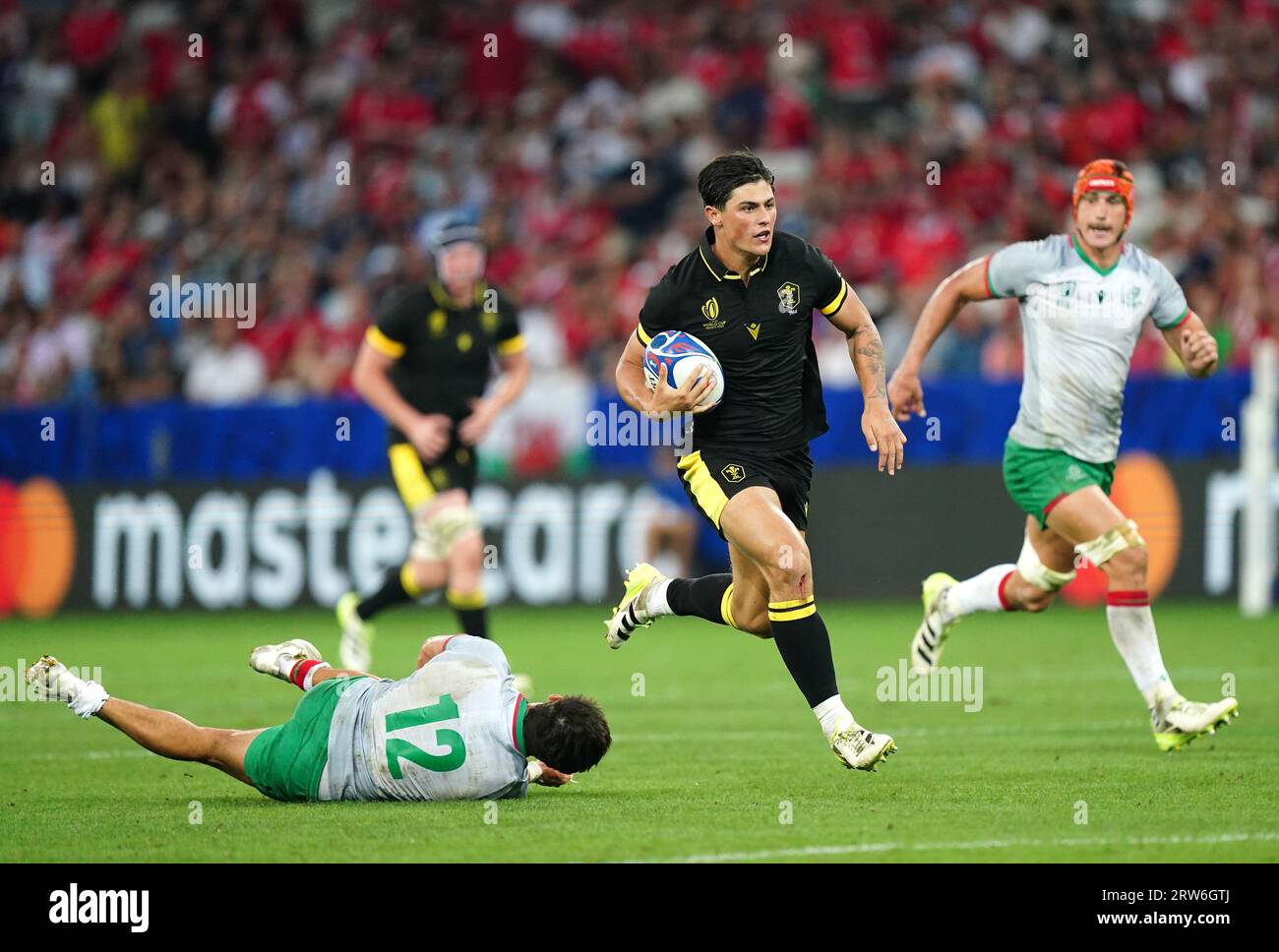 Wales' Louis Rees-Zammit (right) evades Portugal's Tomas Appleton ...