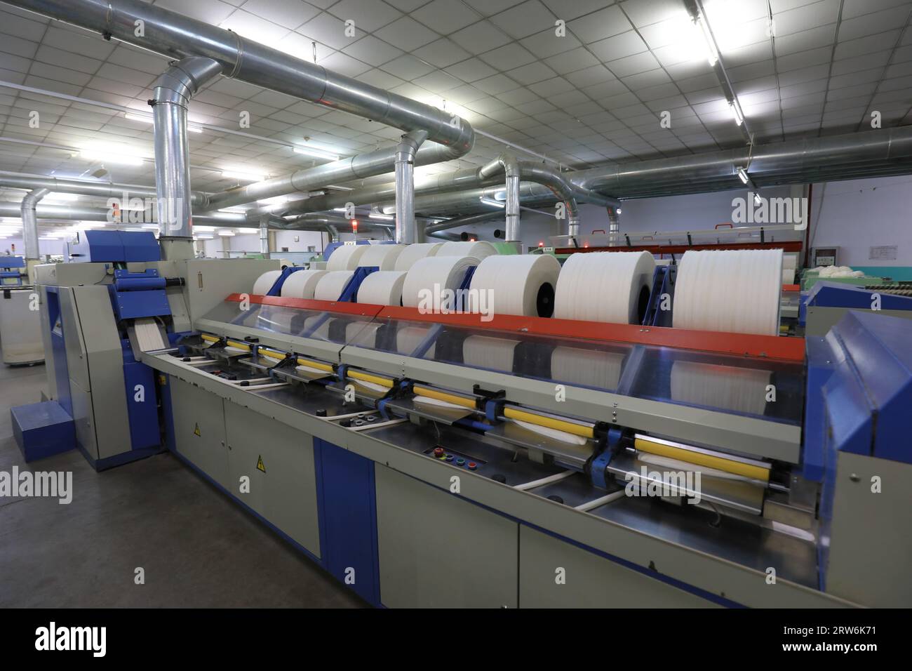 The cotton yarn on the production line is in a spinning factory Stock ...