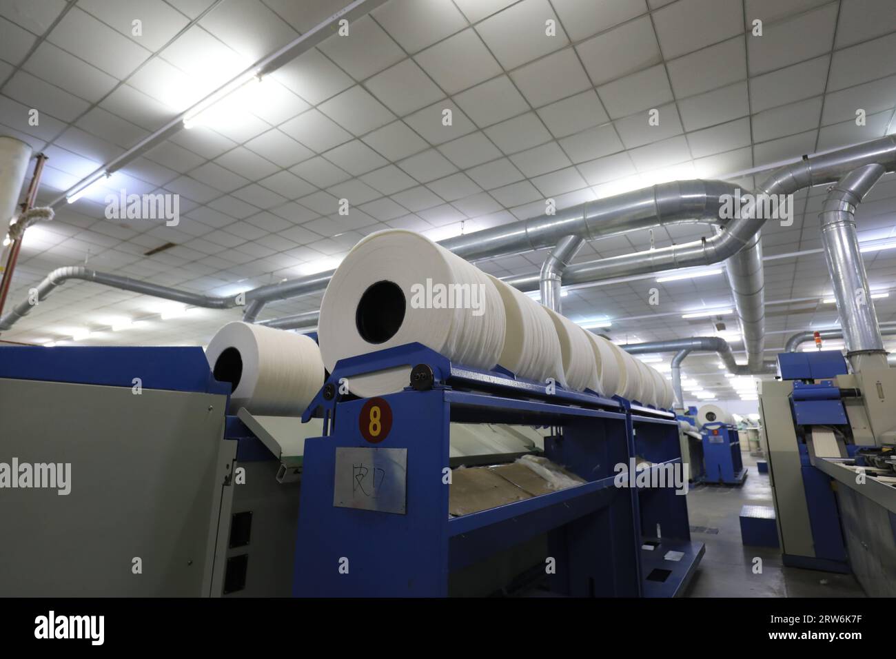 The cotton yarn on the production line is in a spinning factory Stock ...