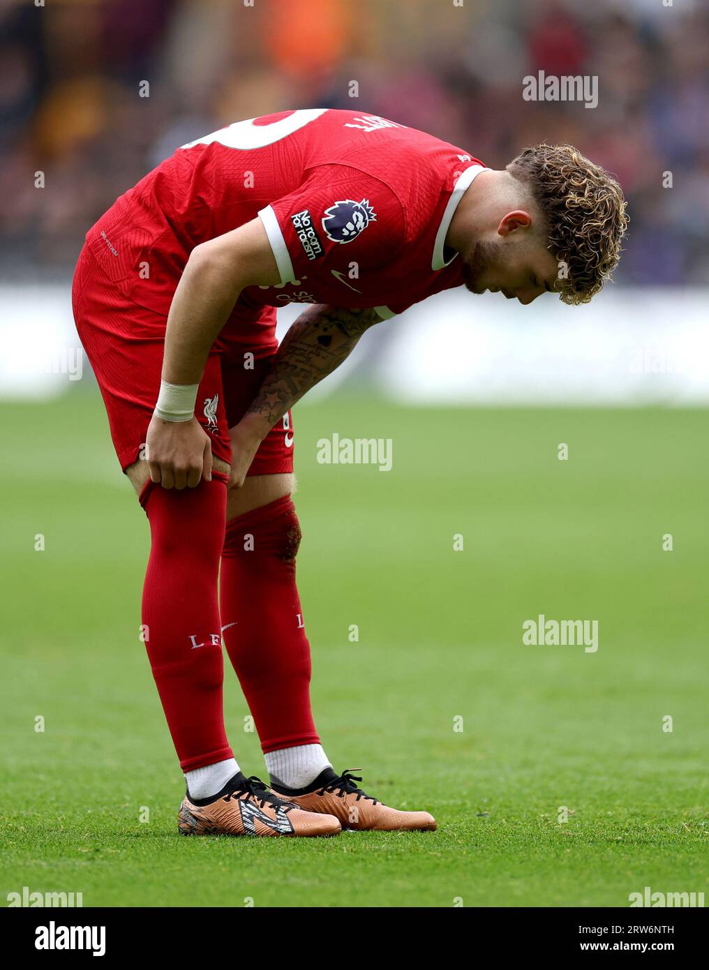 Liverpool's Harvey Elliott pulls up his socks during the Premier League ...